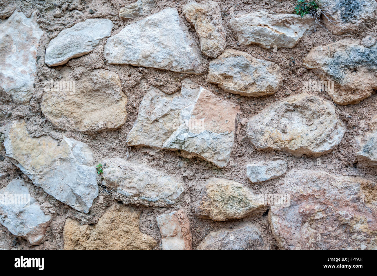 A close up view of an old stone wall Stock Photo - Alamy