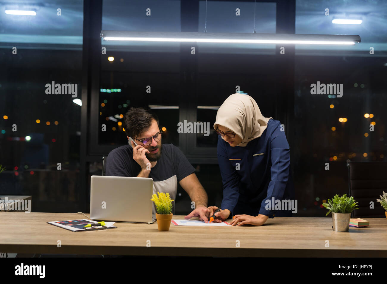 Office colleagues talking at work Stock Photo - Alamy