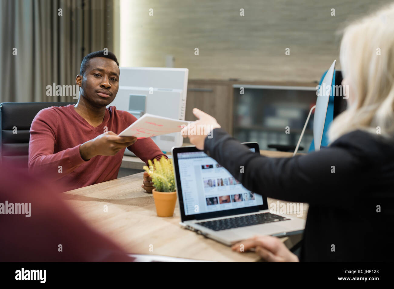 Businessman his colleague giving contract to read and sign Stock Photo ...