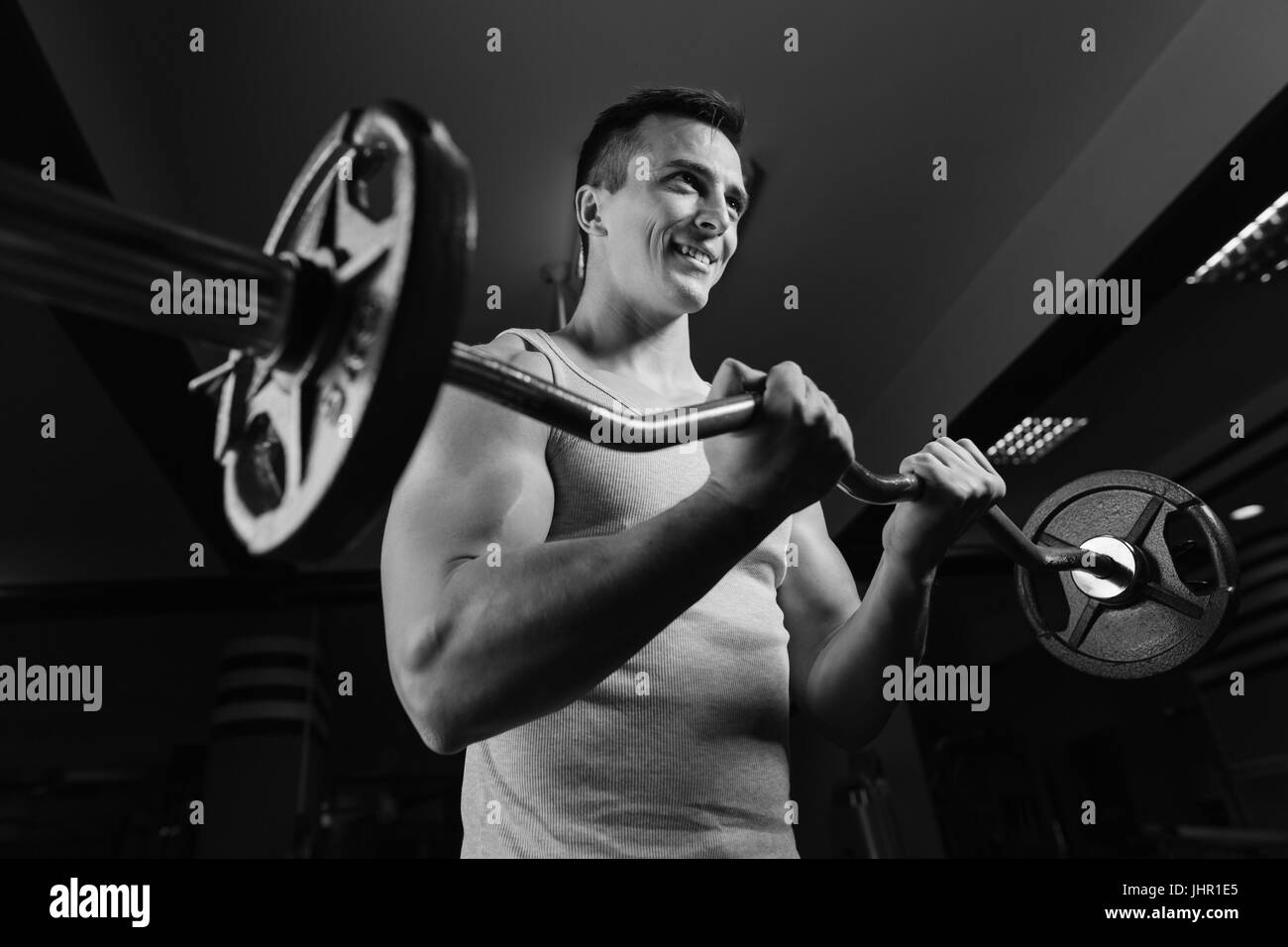 Bodybuilder Working Out Biceps - Dumbbell Concentration Curls Stock ...