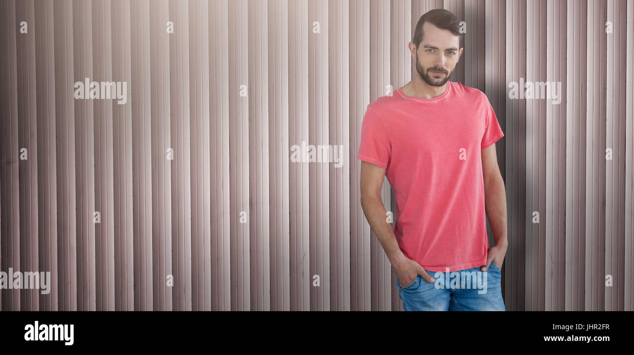Portrait of man with hands in pockets against grey shutters Stock Photo ...