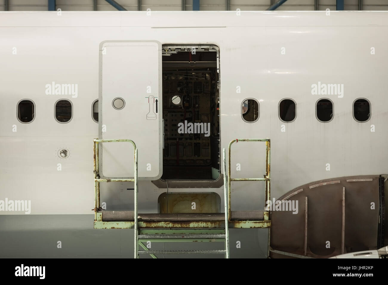 Close-up of aircraft under servicing at airlines maintenance facility ...