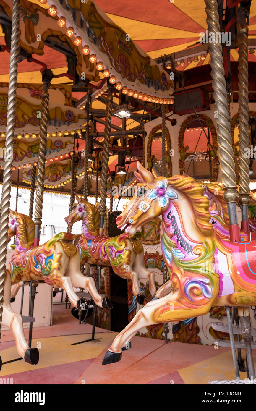Empty merry-go-round ride in amusement park Stock Photo - Alamy