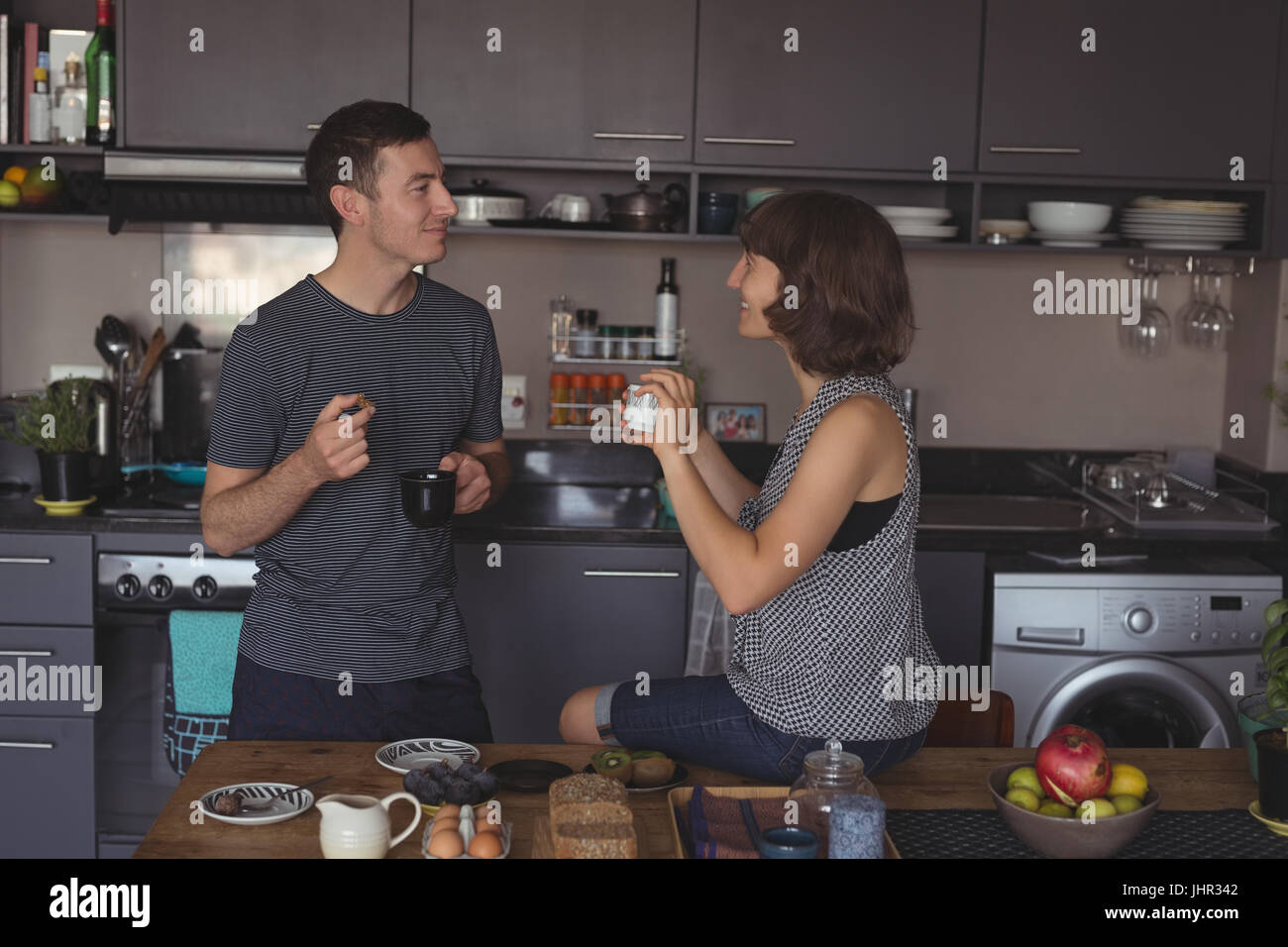 Romantic couple in kitchen 30s adult hi-res stock photography and images - Alamy