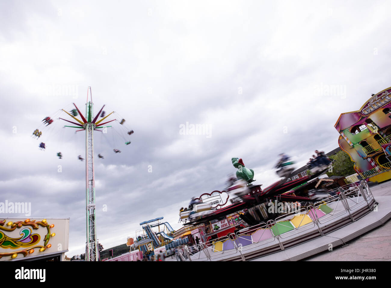 Various rides in amusement park at day Stock Photo - Alamy