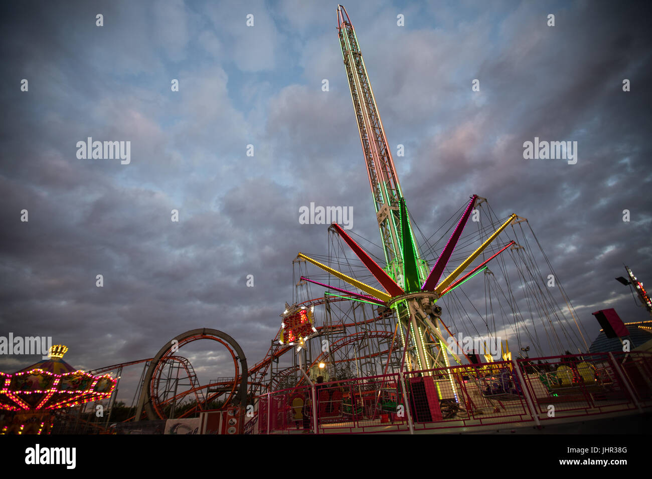 Rides in fair dusk hi-res stock photography and images - Alamy