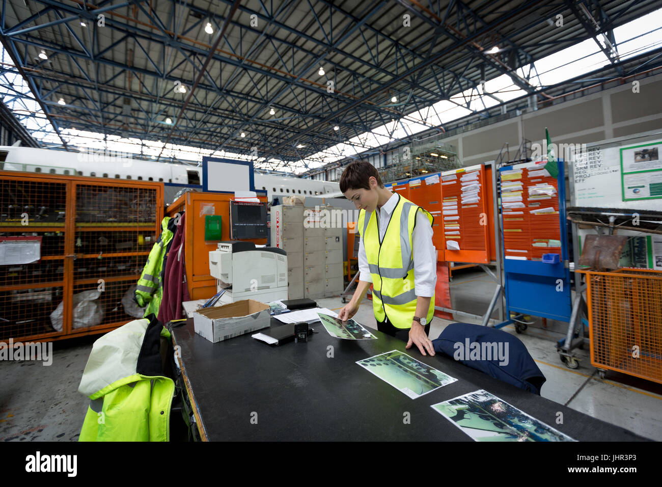 Female aircraft maintenance engineer working at airlines maintenance ...