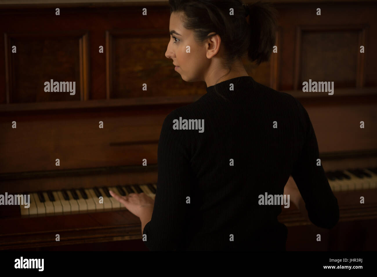 Piano woman rear view hi-res stock photography and images - Alamy
