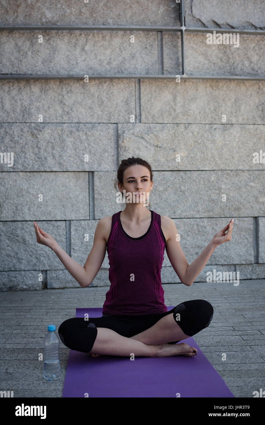Fit woman performing yoga in fitness studio Stock Photo - Alamy