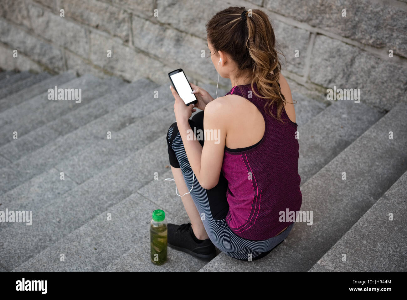 Woman steps smart phone hi-res stock photography and images - Alamy