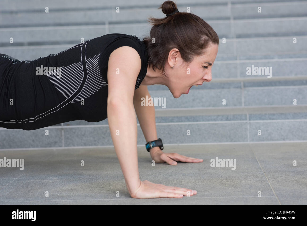 Fit woman doing pushups on staircase Stock Photo - Alamy