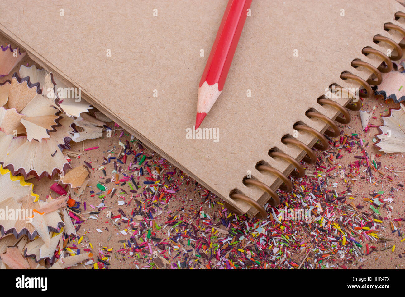 Red Color Pencil over some pencil shavings Stock Photo - Alamy