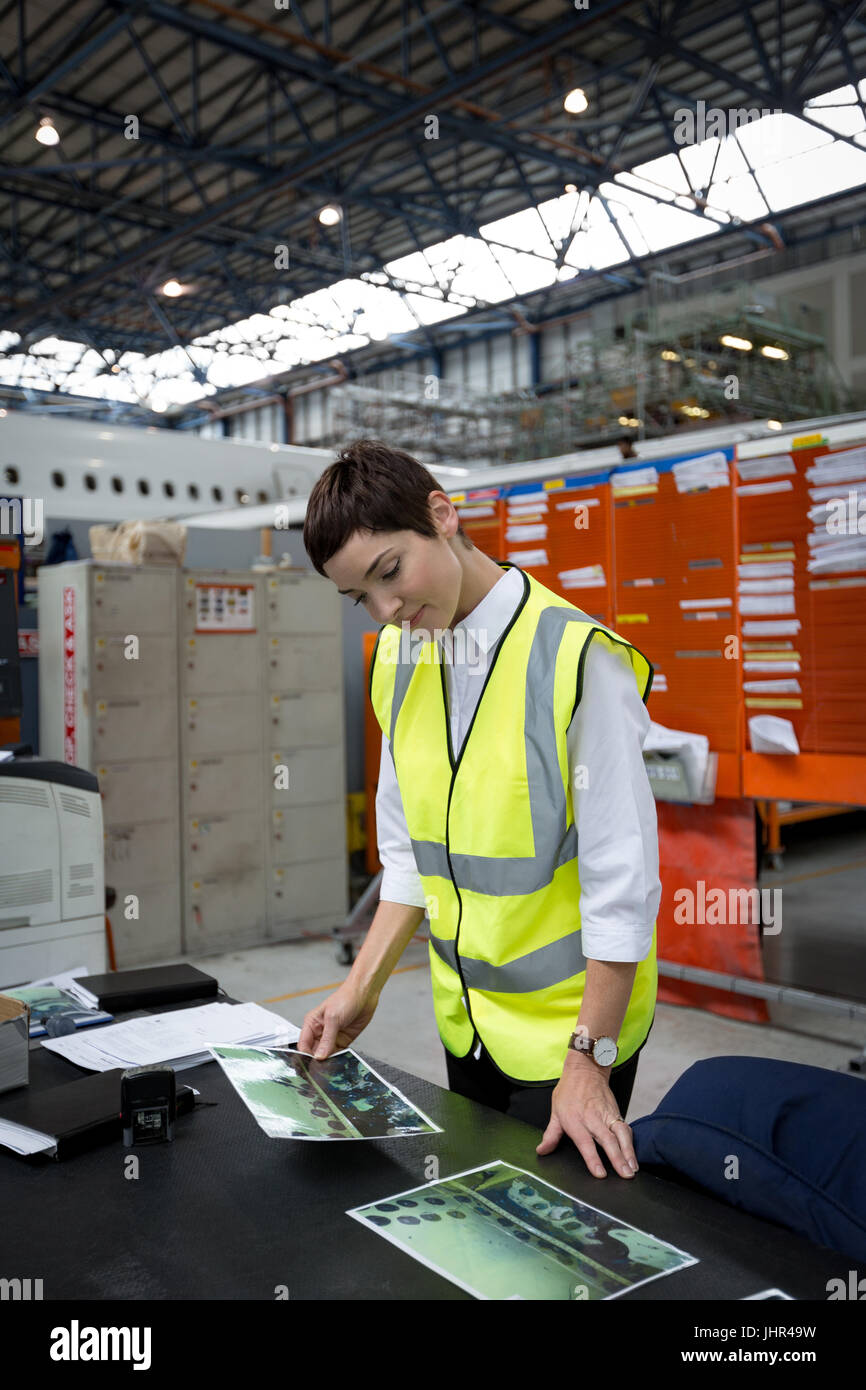 Female aircraft maintenance engineer working at airlines maintenance ...