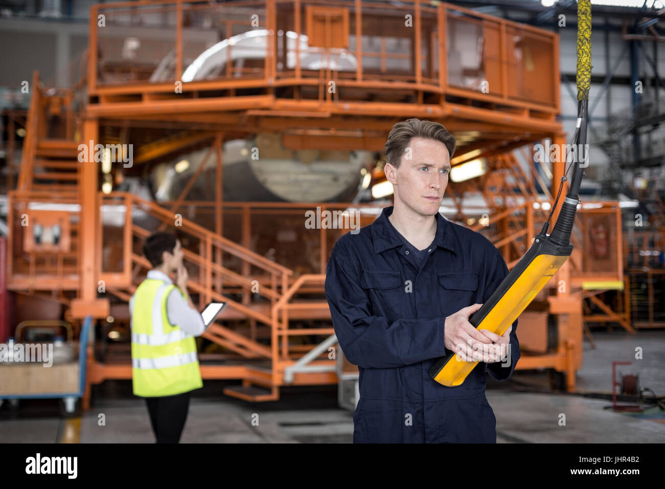 Maintenance engineer operating a control panel at airlines maintenance ...