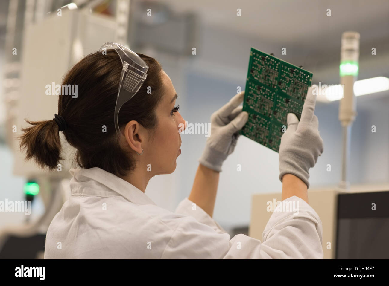 Female technician checking circuit board hi-res stock photography and ...