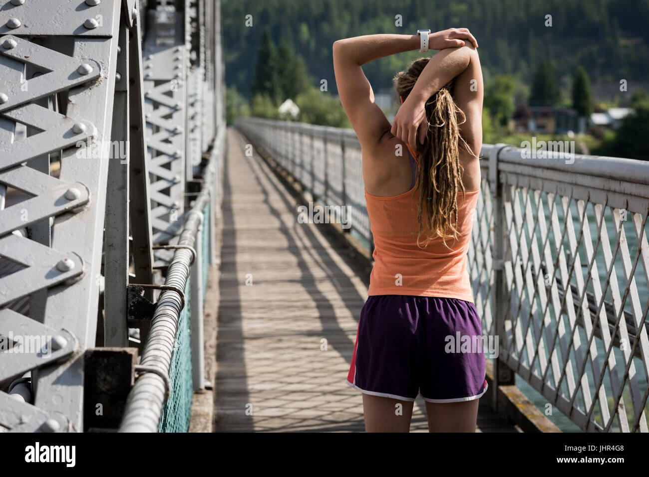 Woman arms raised rear view sky hi-res stock photography and images - Alamy