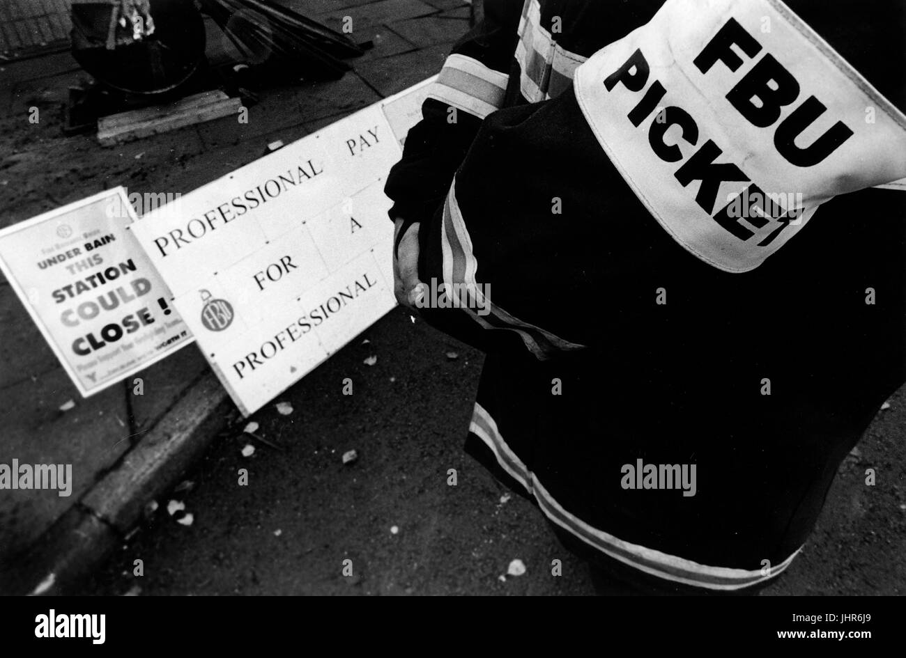 Fire Fighter of West Midlands Fire Brigade mans picket line during ...