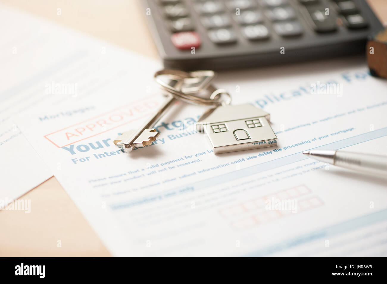 Approved Mortgage loan application with house key Stock Photo - Alamy