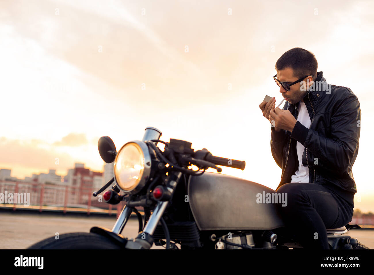 Handsome rider male with beard and mustache in black biker jacket and ...
