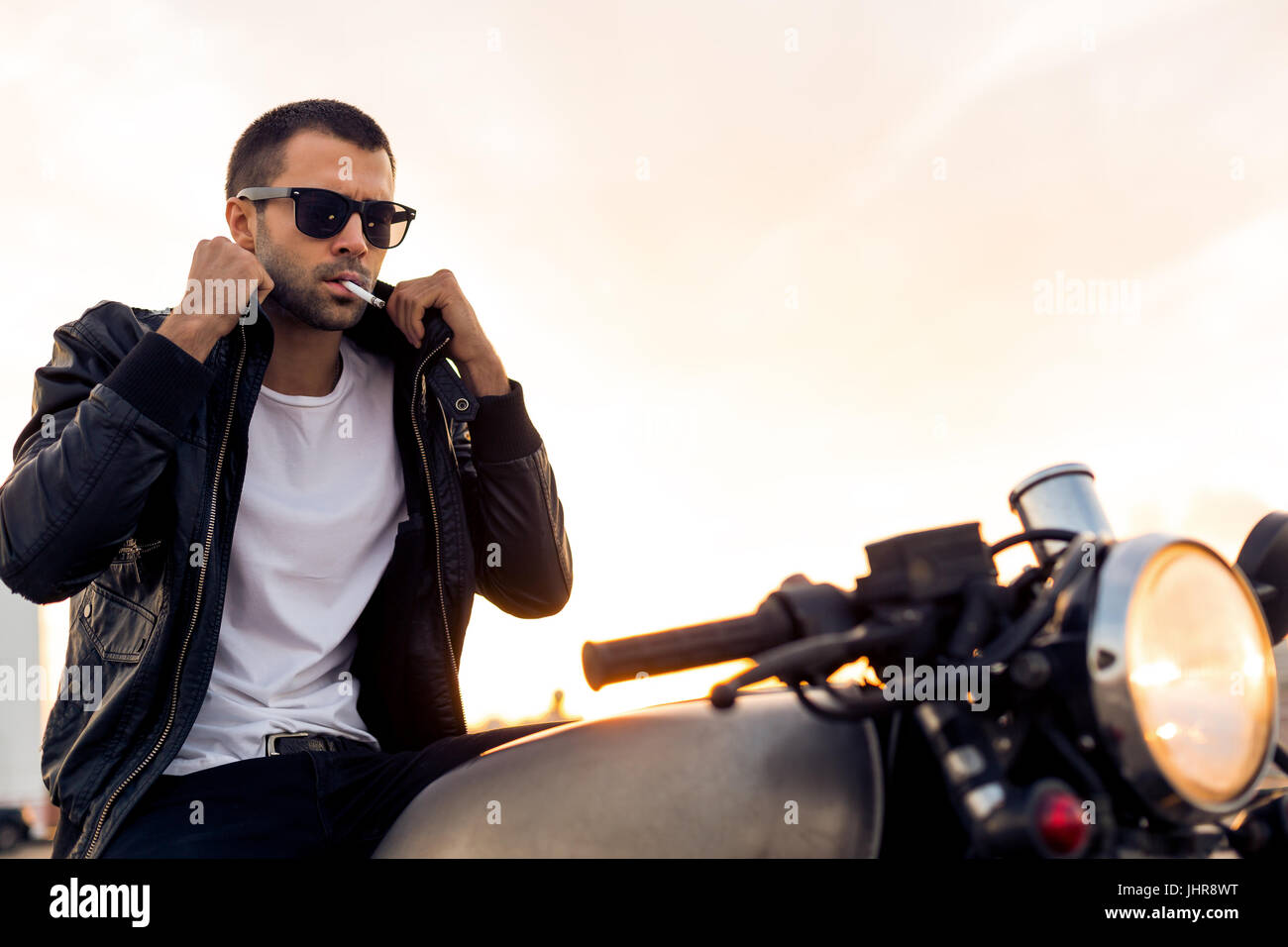 Beautiful happy rider man with beard and mustache in black fashion ...