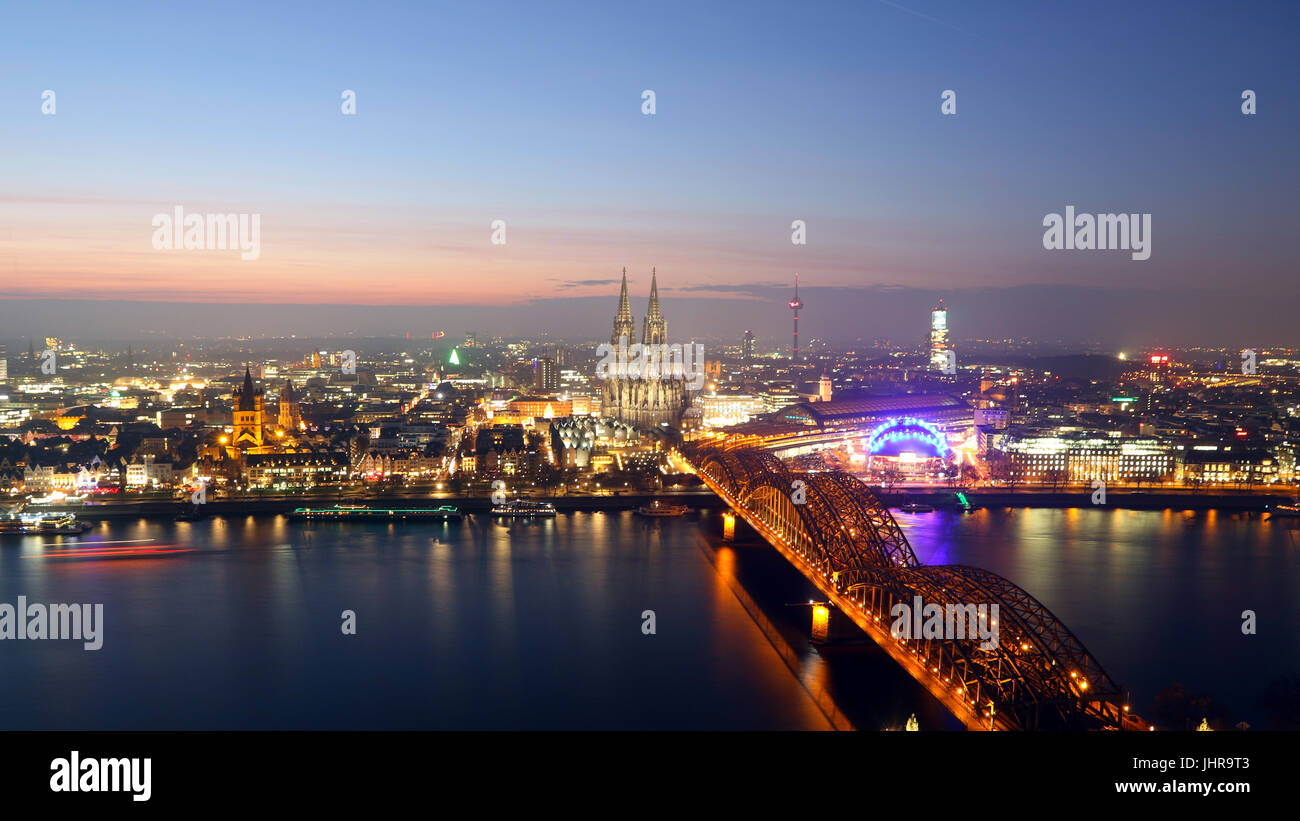 Riverside view of the Cologne Cathedral and railway bridge over the ...