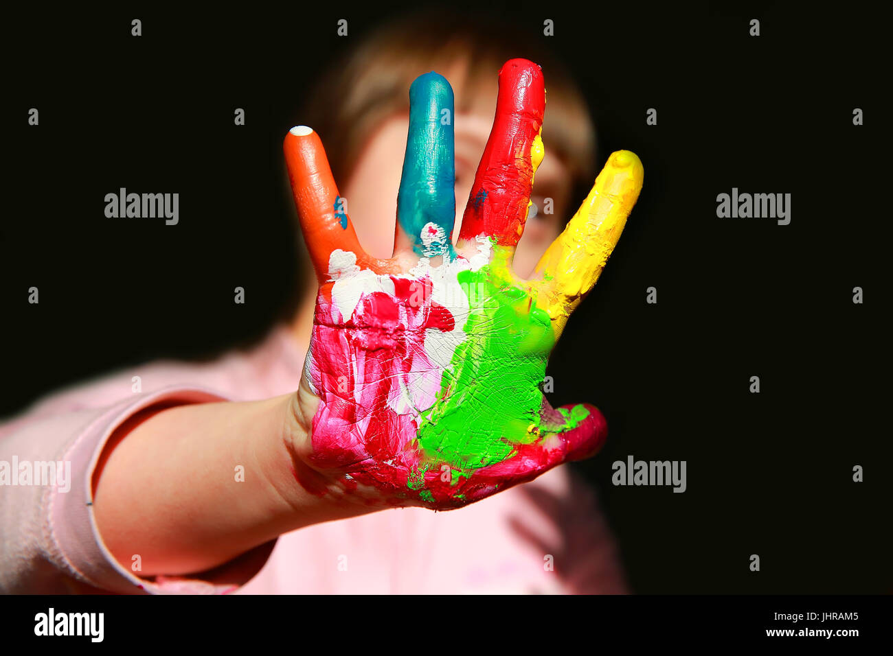 Cute little kid with painted hands Stock Photo - Alamy