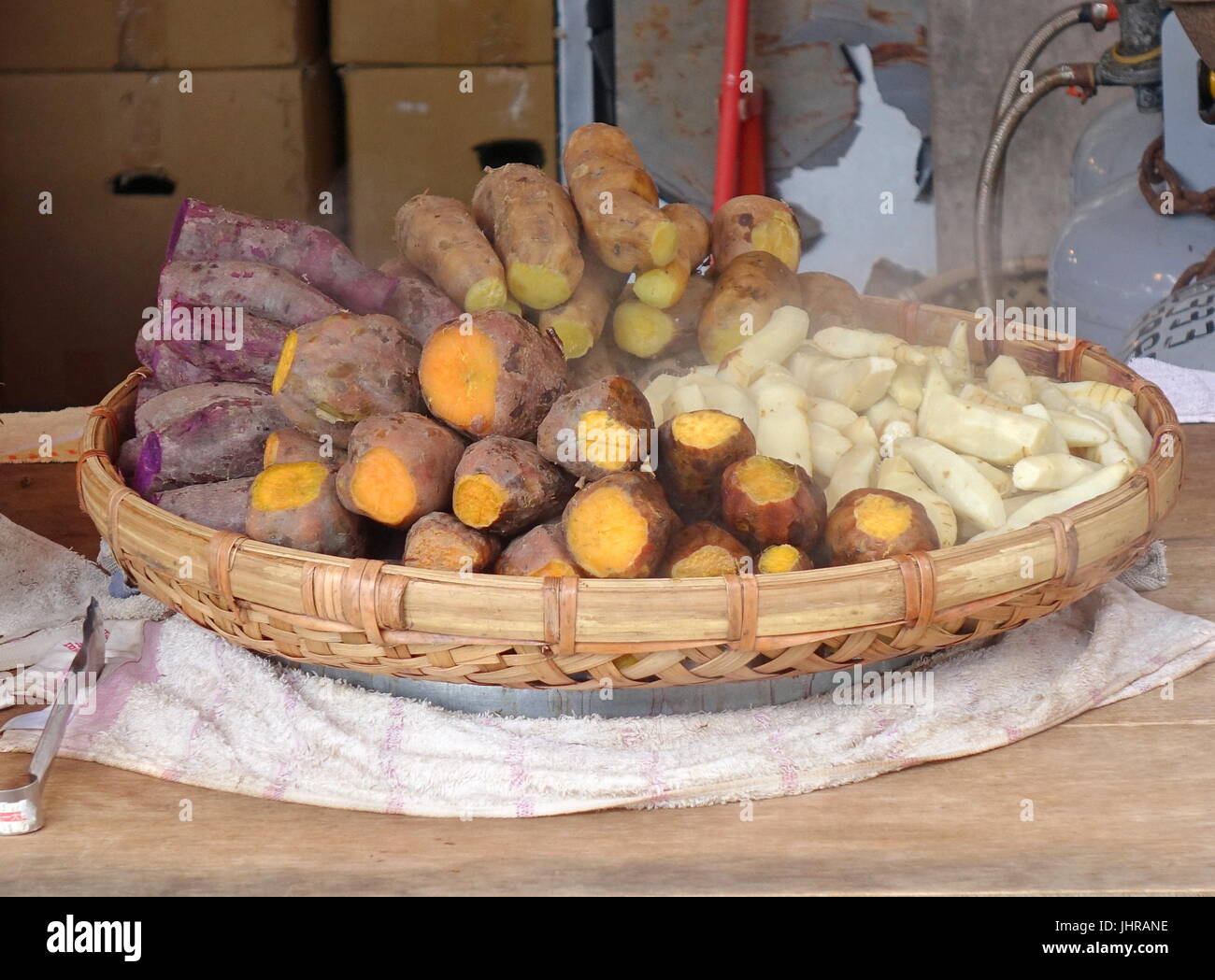 A street vendor sells steamed yams and sweet potatoes Stock Photo - Alamy