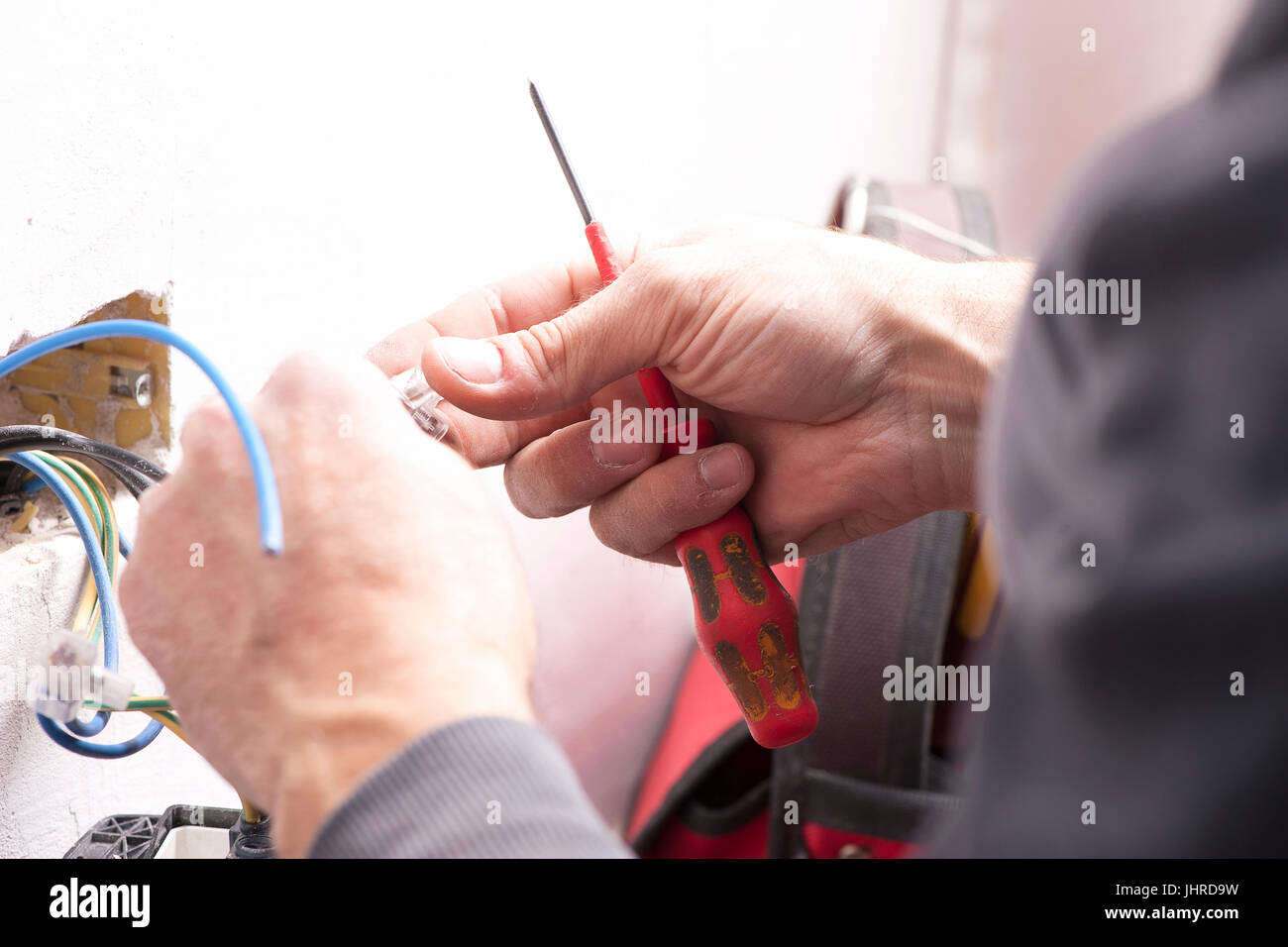 The hands of an electrician Stock Photo - Alamy
