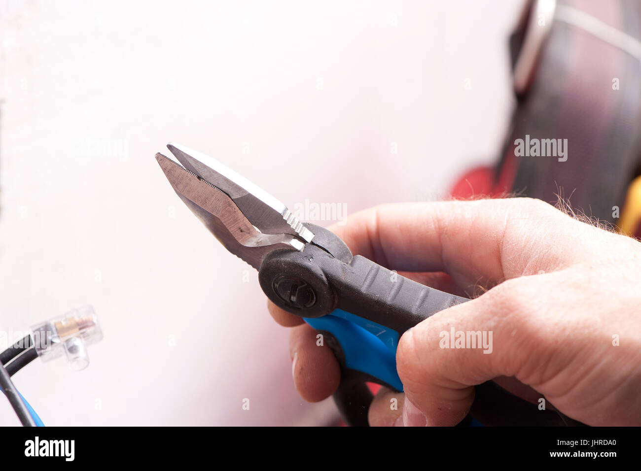 The hands of an electrician Stock Photo - Alamy