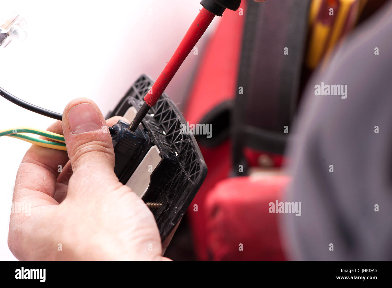 The hands of an electrician Stock Photo - Alamy