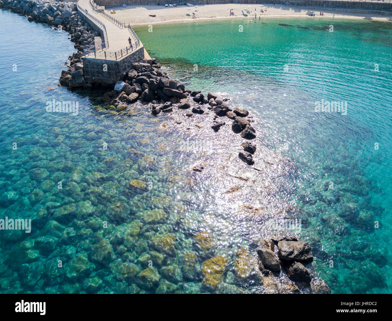 Aerial view of a pier with rocks and rocks on the sea. Pier of Pizzo ...