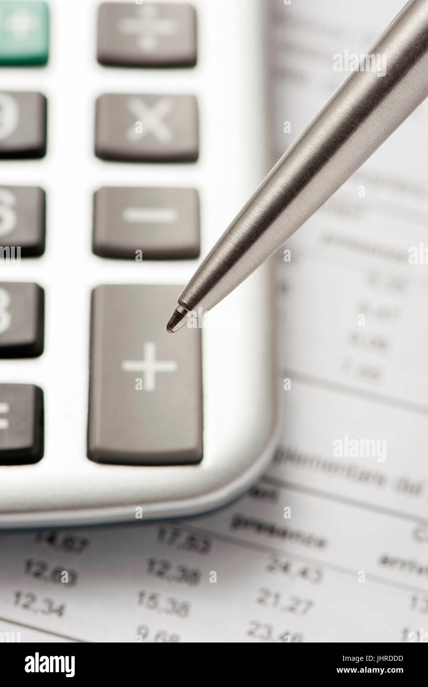 Pen and calculator Stock Photo - Alamy