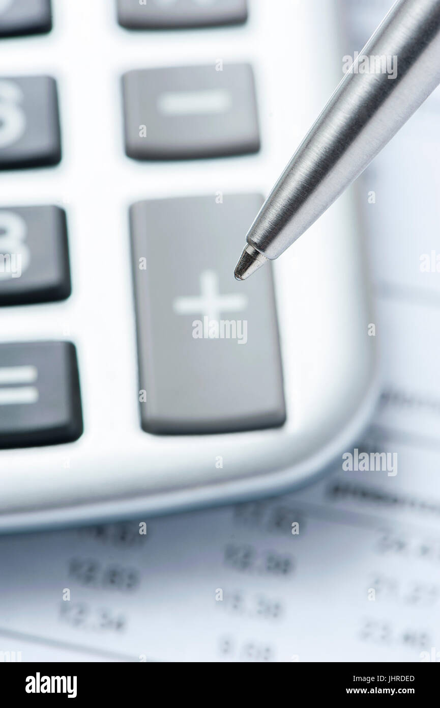 Pen and calculator Stock Photo - Alamy