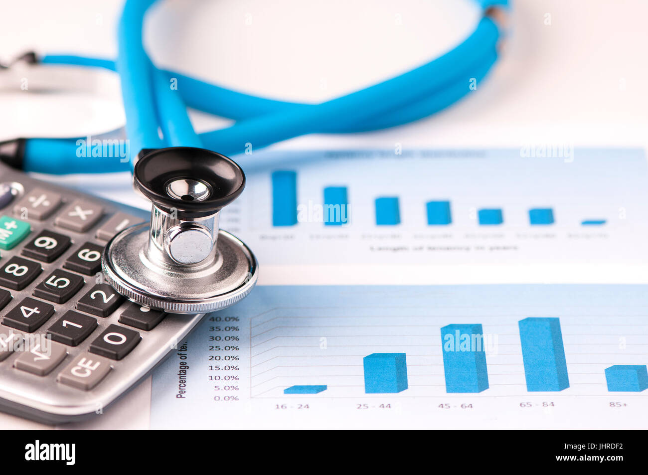 Stethoscope and financial charts Stock Photo - Alamy