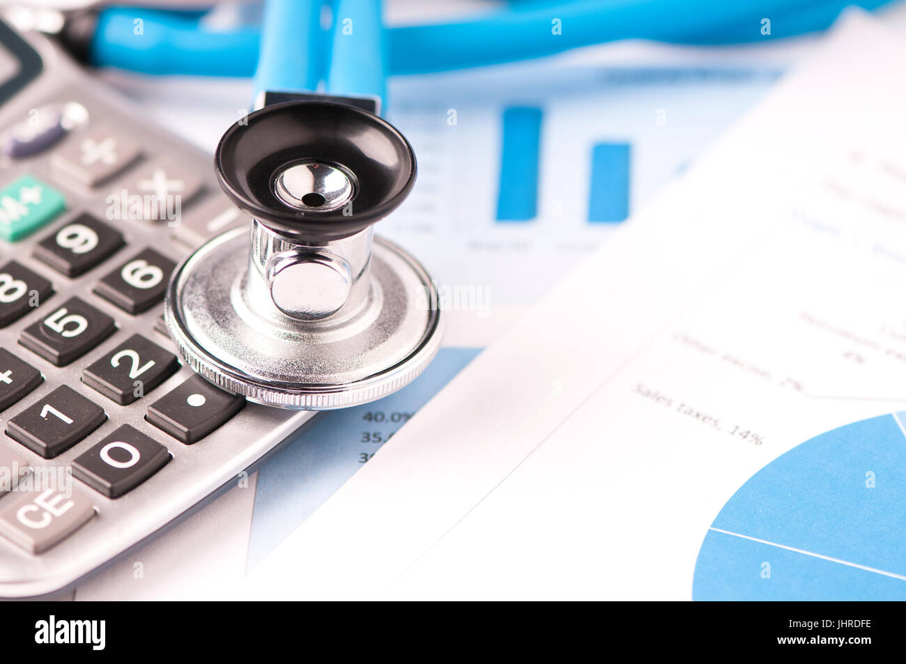 Stethoscope and financial charts Stock Photo - Alamy