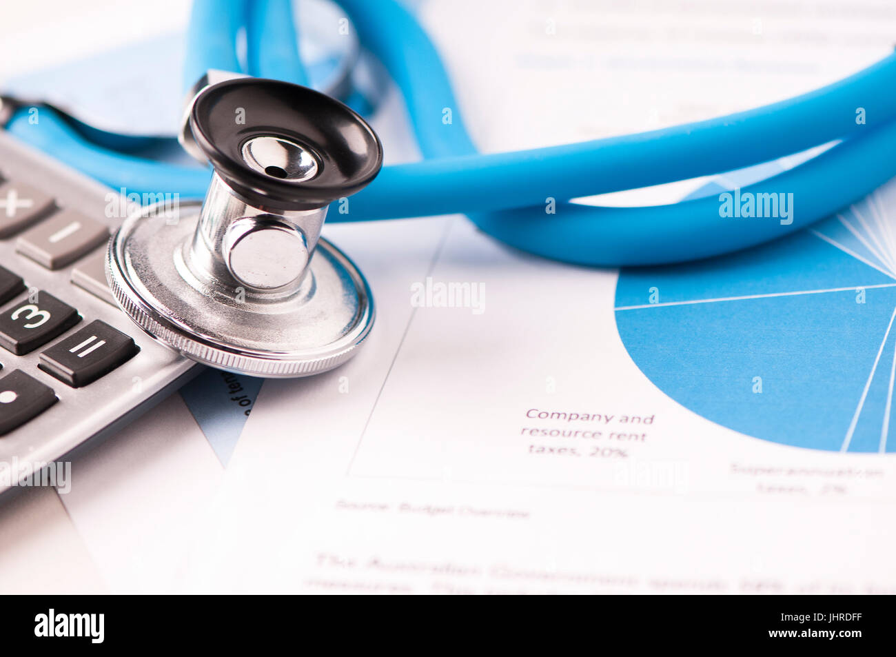 Stethoscope and financial charts Stock Photo - Alamy