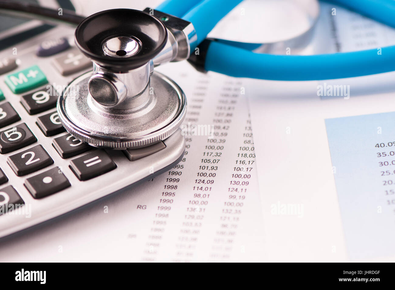 Stethoscope and financial charts Stock Photo - Alamy