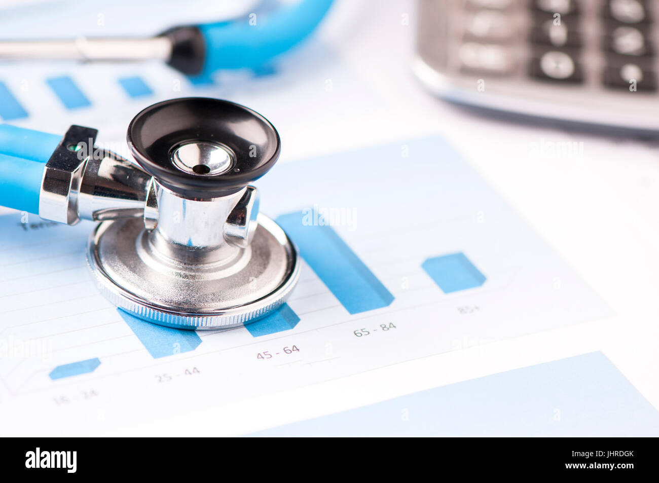 Stethoscope and financial charts Stock Photo - Alamy