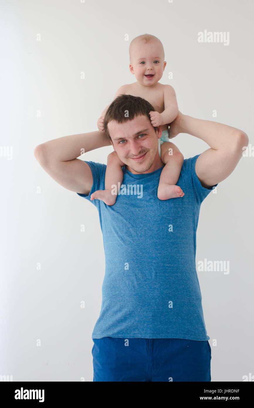 Baby on father's shoulder hi-res stock photography and images - Alamy
