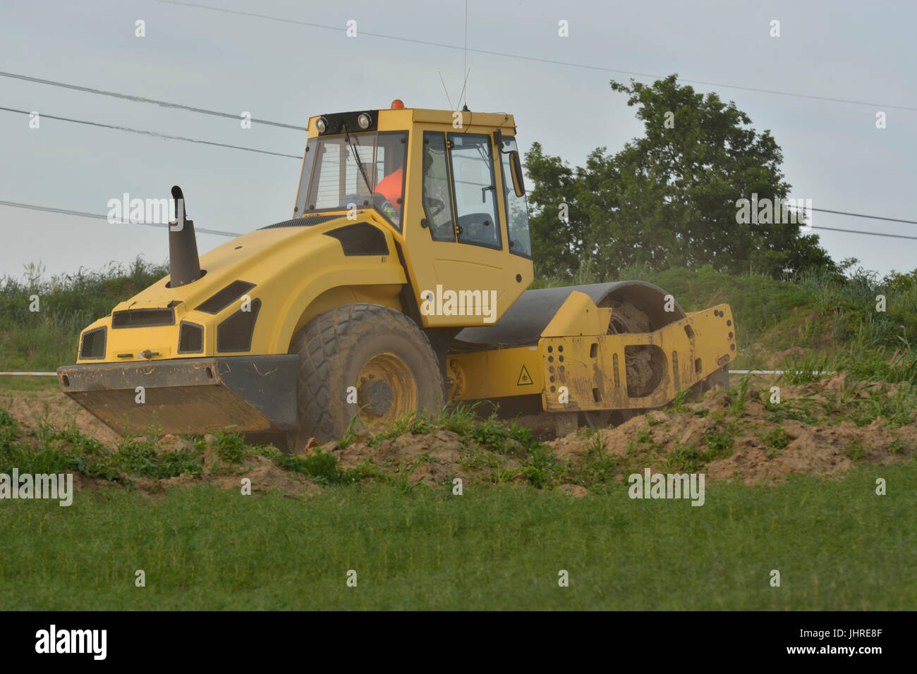 Road roller when curing the first layers of the road Stock Photo - Alamy