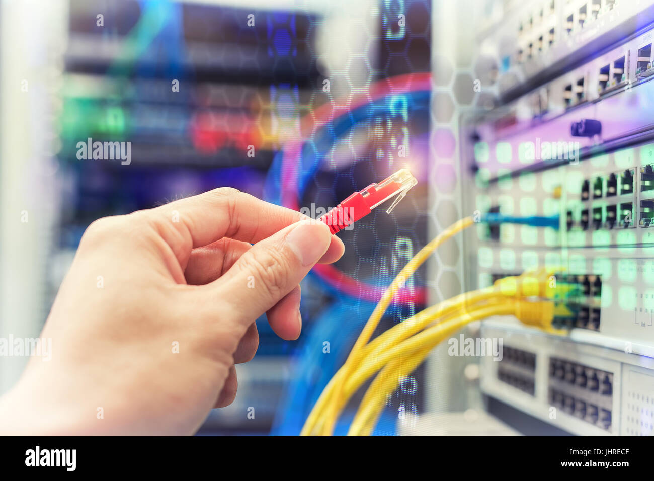 hand with network cables connected to servers in a datacenter Stock ...