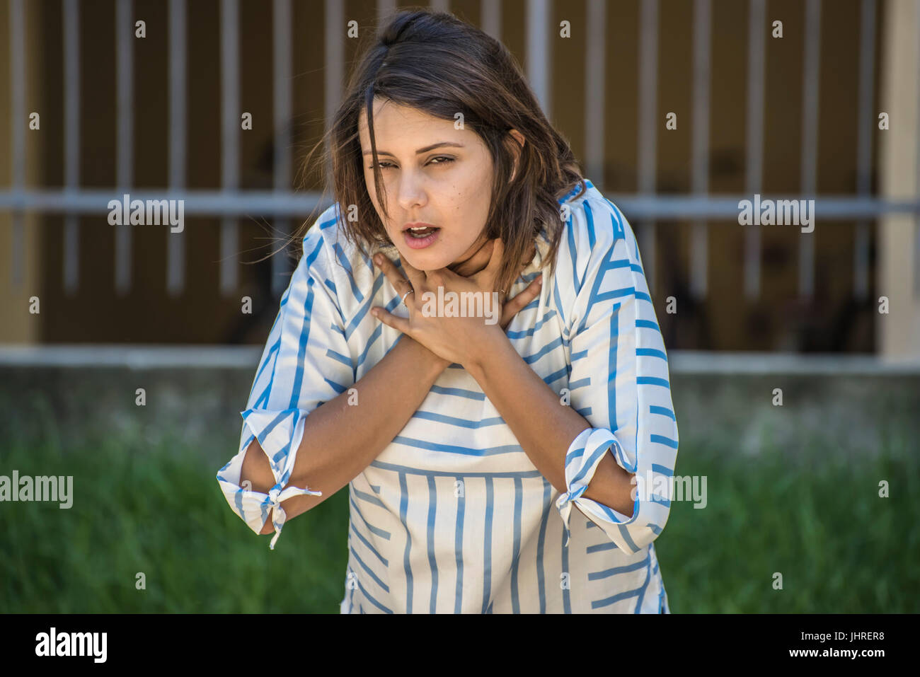 girl searching help while she's choking during feeding Stock Photo - Alamy