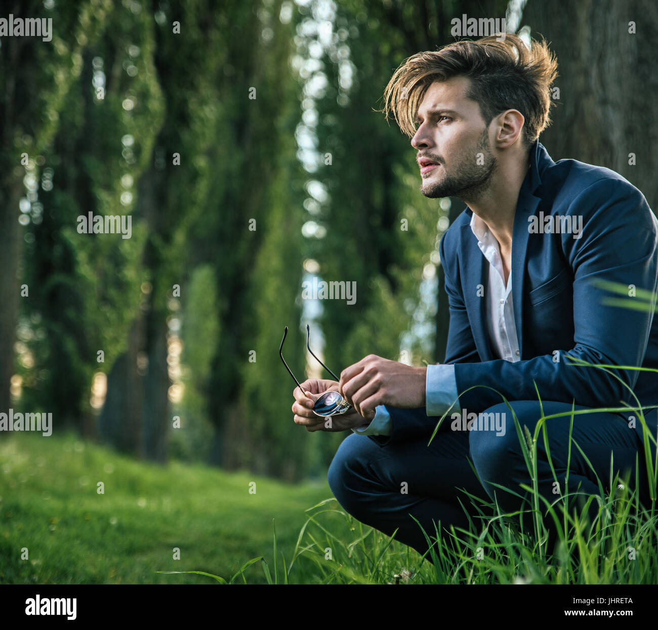 Young, calm guy enjoying the summer time Stock Photo - Alamy