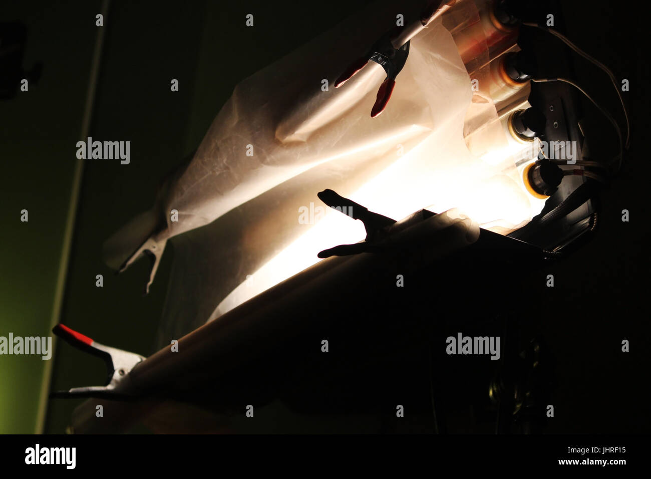 A lighting device on a tripod with fluorescent lamps and a thin filter ...
