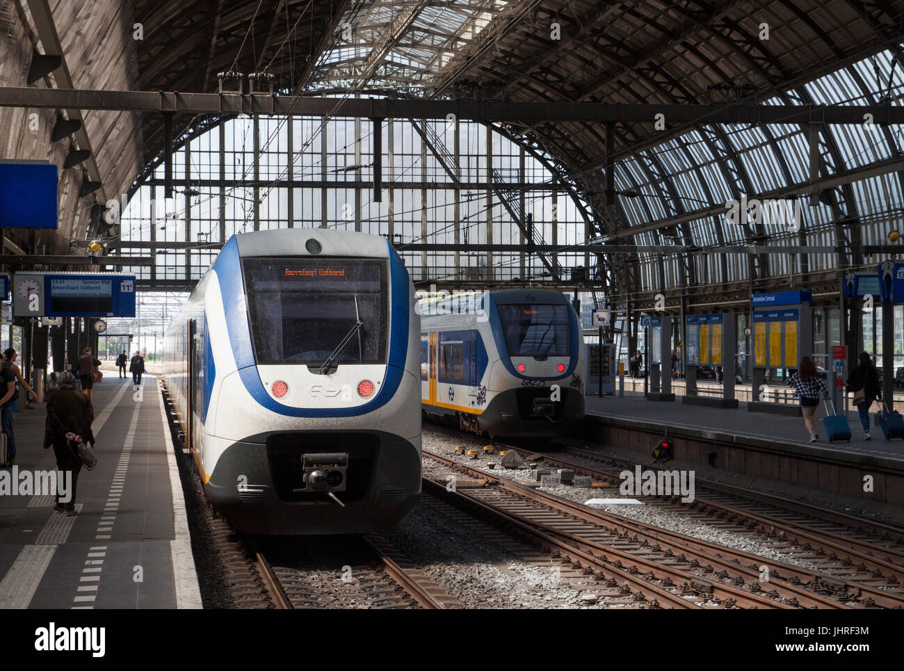 AMSTERDAM, THE NETHERLANDS - MAY 24, 2017:Two sprinter trains of dutch ...