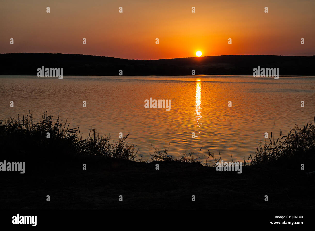 Photo of the setting sun Stock Photo - Alamy