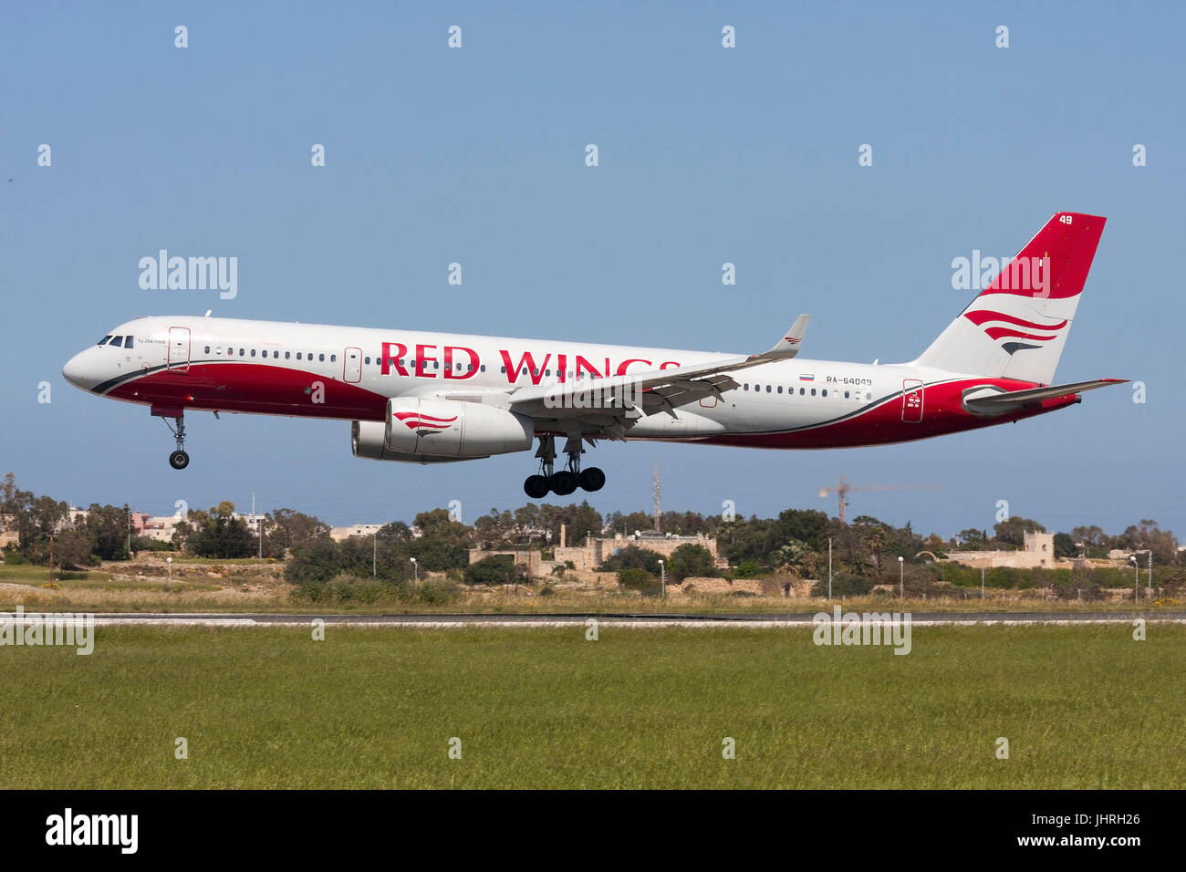 Red Wings Tupolev Tu-204-100V landing runway 31 Stock Photo - Alamy