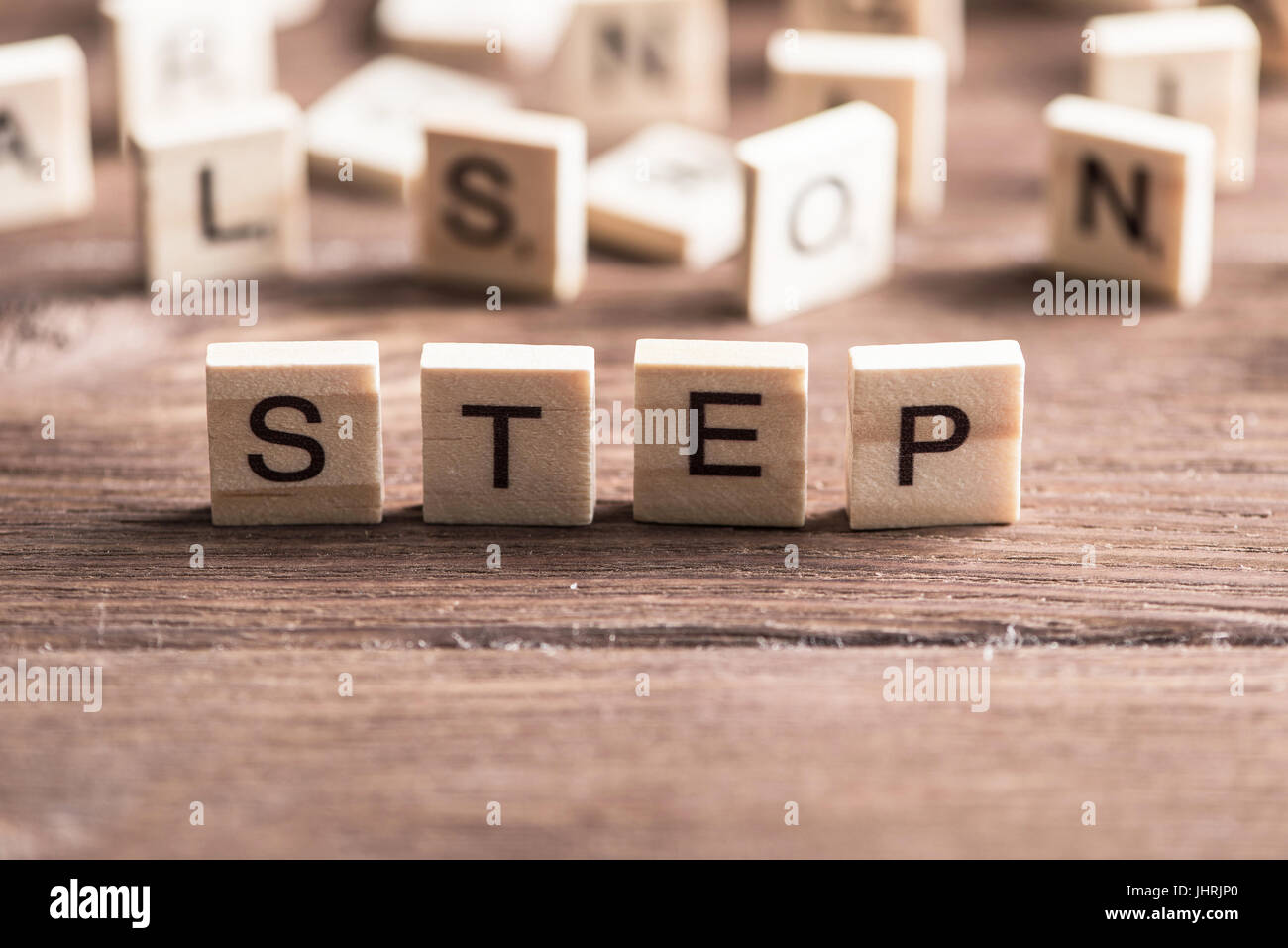 wooden elements with letter collected word step Stock Photo - Alamy