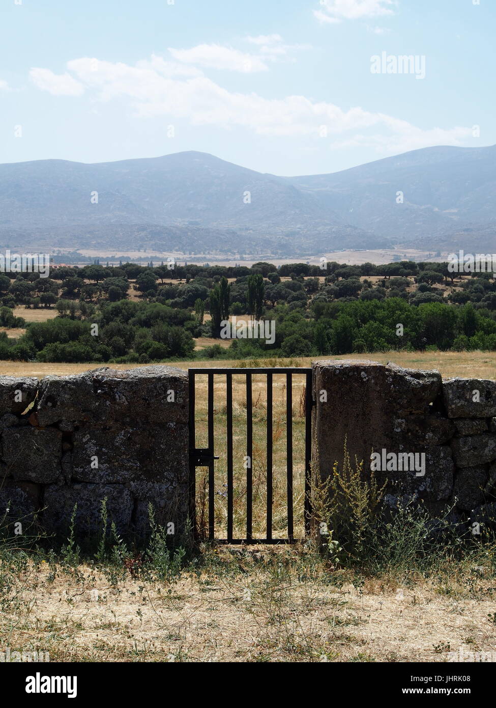 A garden gate in front of Spanish mountains Stock Photo - Alamy