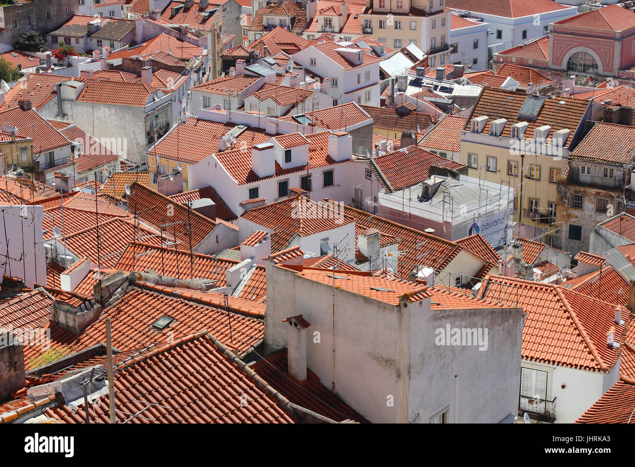Red orange terracotta tile rooftops on white buildings in lisbon hi-res ...